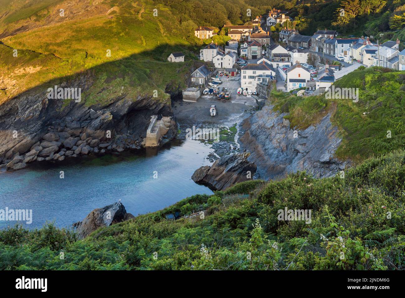 View down to the picturesque fishing village of Portloe on the south ...