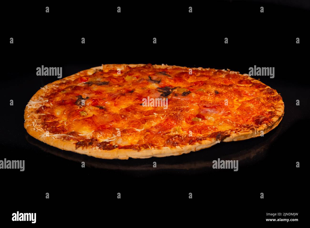 Burnt homemade pizza on tray in electric oven, black background Stock ...