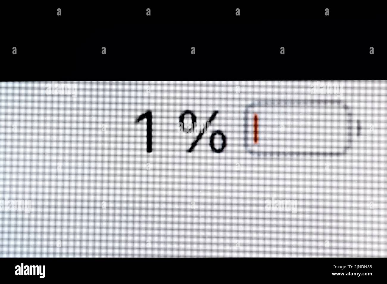 Smartphone charged battery level indicator - one, 1 percent: close up ...