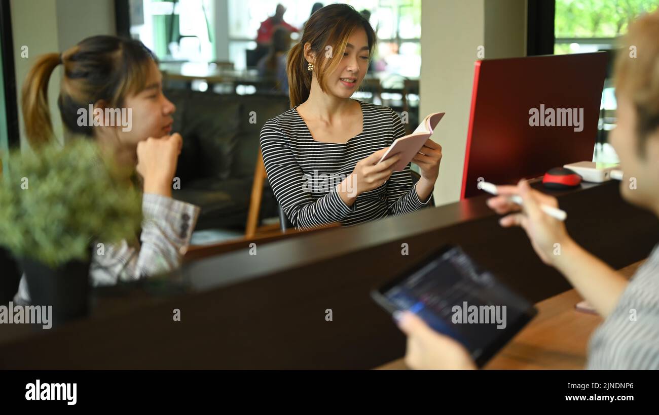 Creative software development team brainstorming, working with coded ...