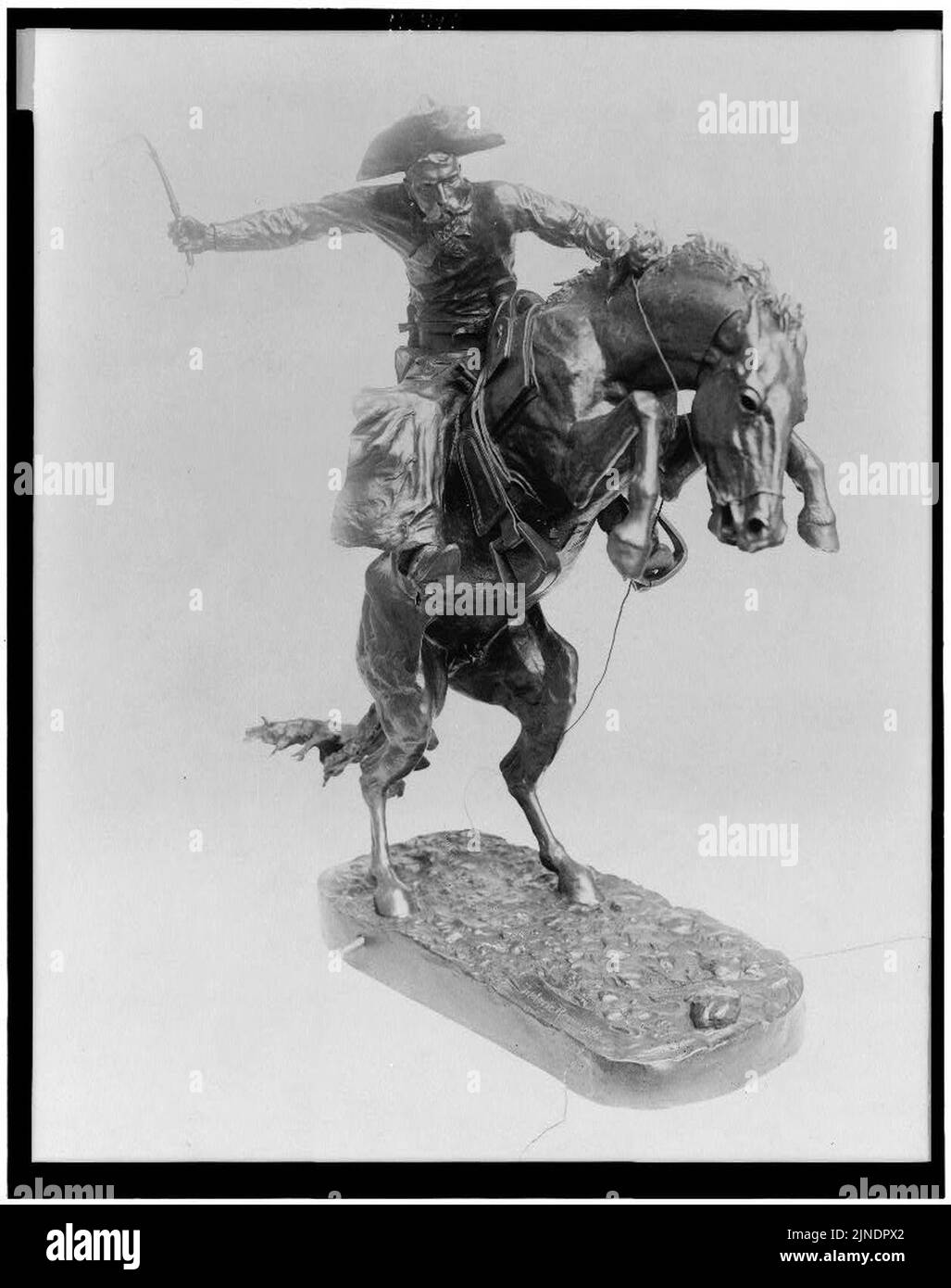 The bronco buster by Frederic Remington Stock Photo - Alamy
