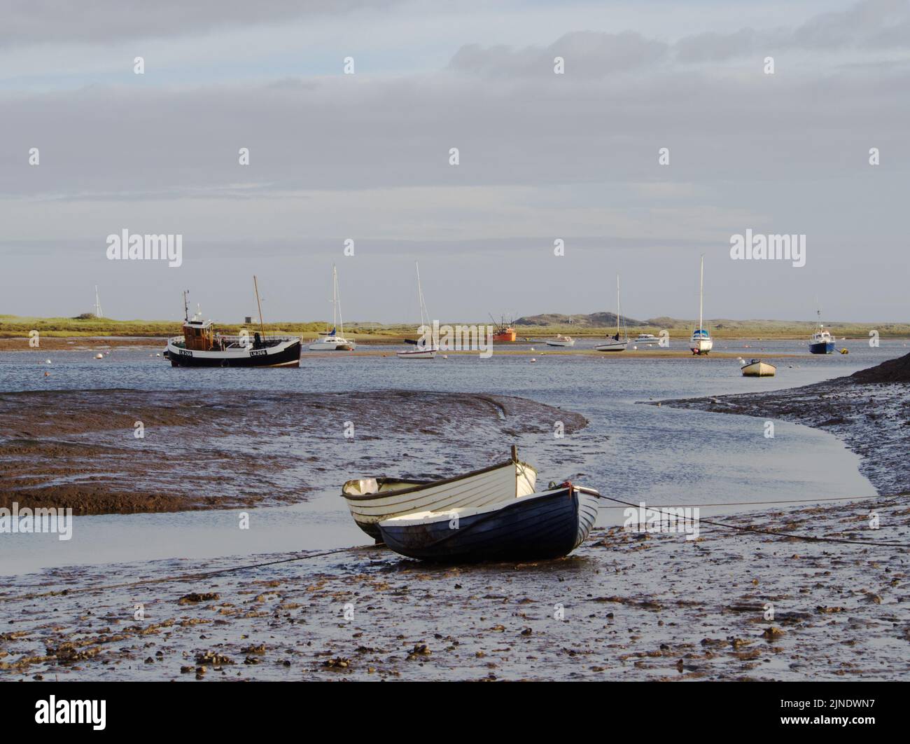 boats on mudflats at low tide, Brancaster Staithe quay October 2020 ...
