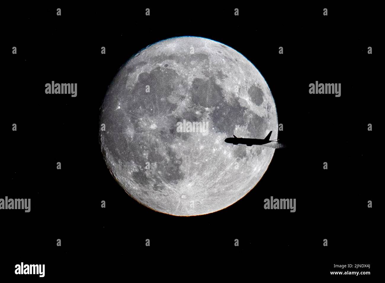 London ,United Kingdom -10/08/2022. A plane crosses the Sturgeon Full ...