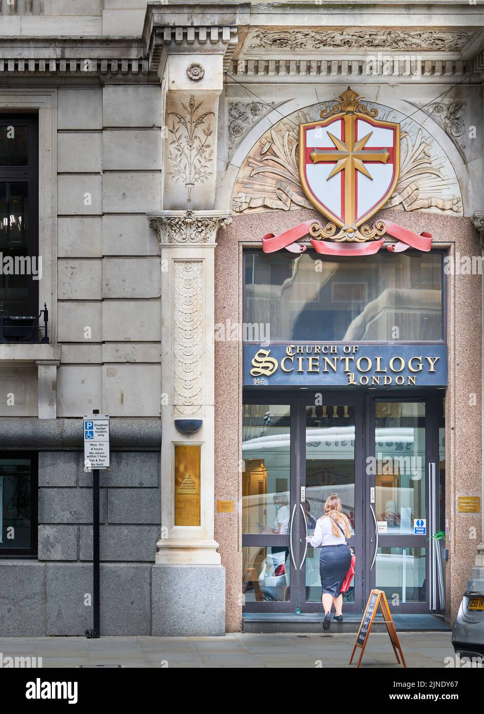 A woman enters the Church of Scientology building, London, England ...