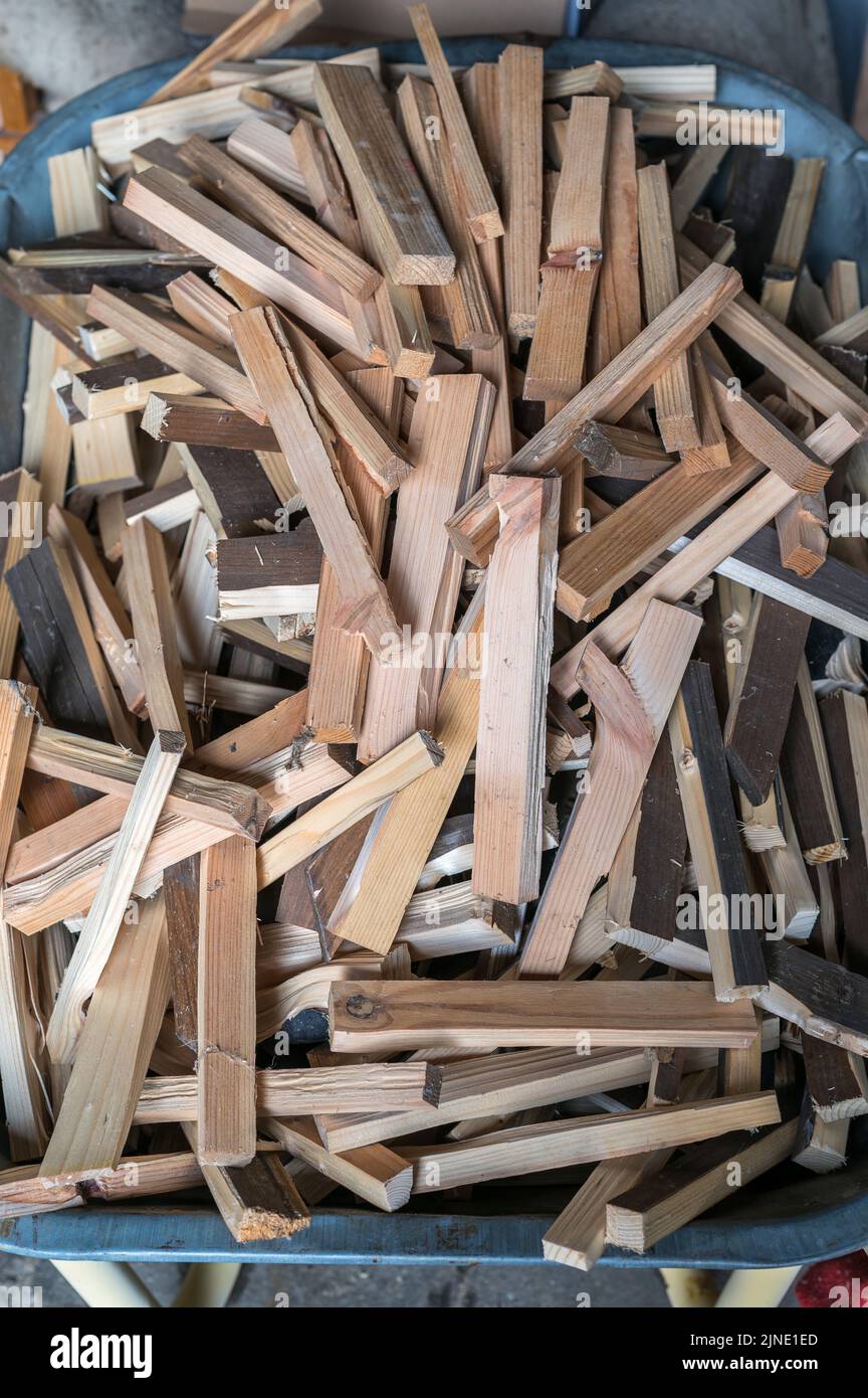 Crushed wood in a wheelbarrow as kindling for the fireplace Stock Photo ...