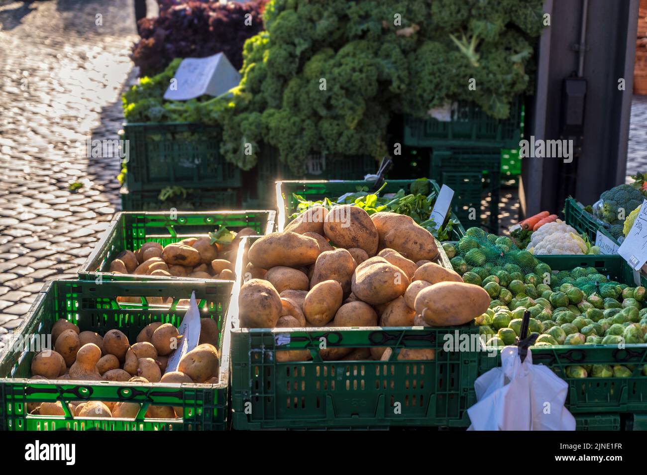 Fresh potatoes and Brussels sprouts at a market stall Stock Photo - Alamy