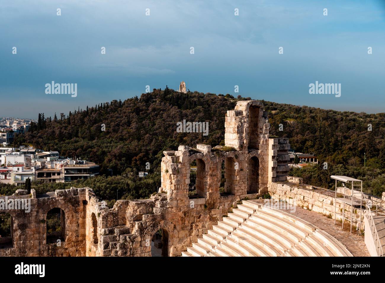A scenic view of the Acropolis of Athens, Greece with forests in the ...