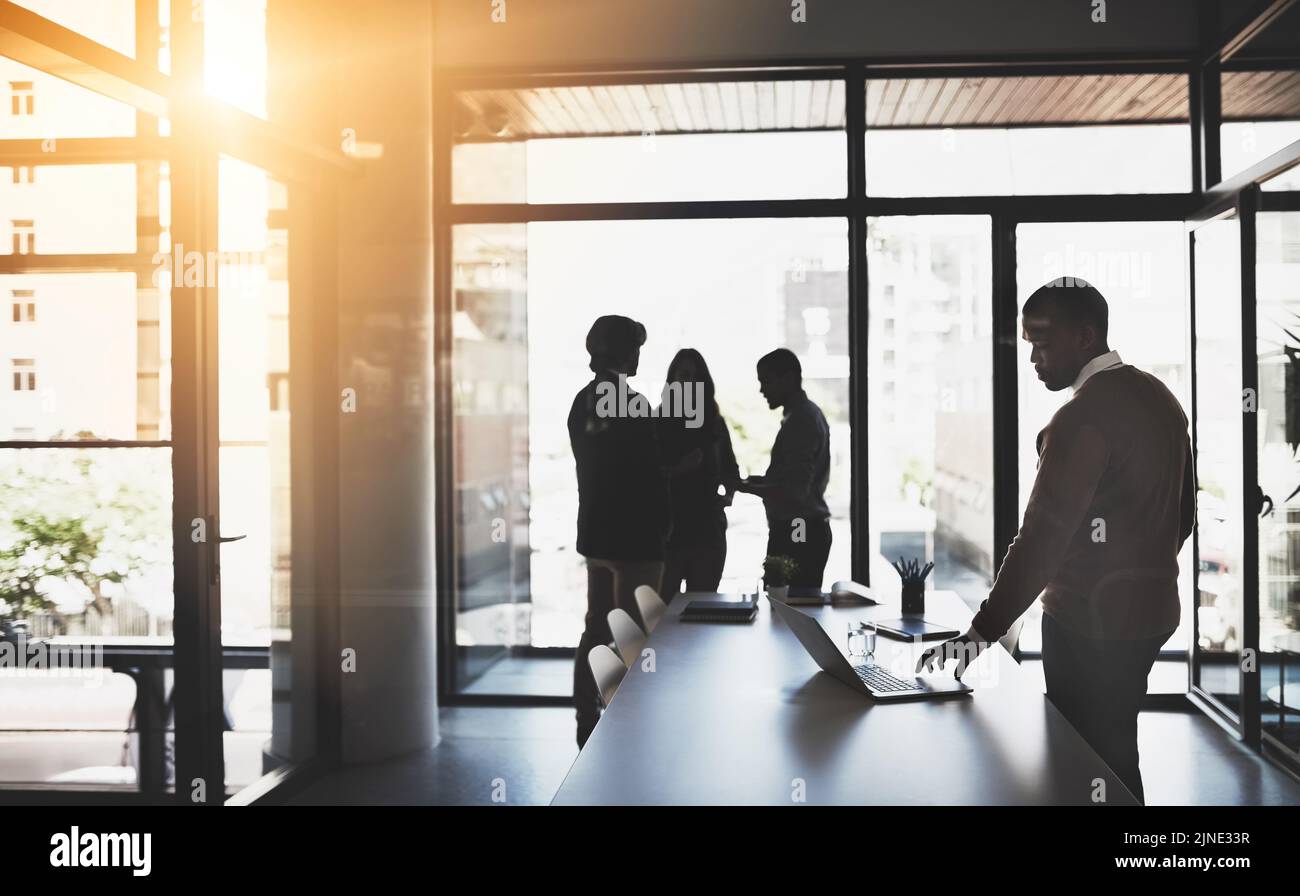 Silhouette of team waiting for presentation in boardroom with leader ...