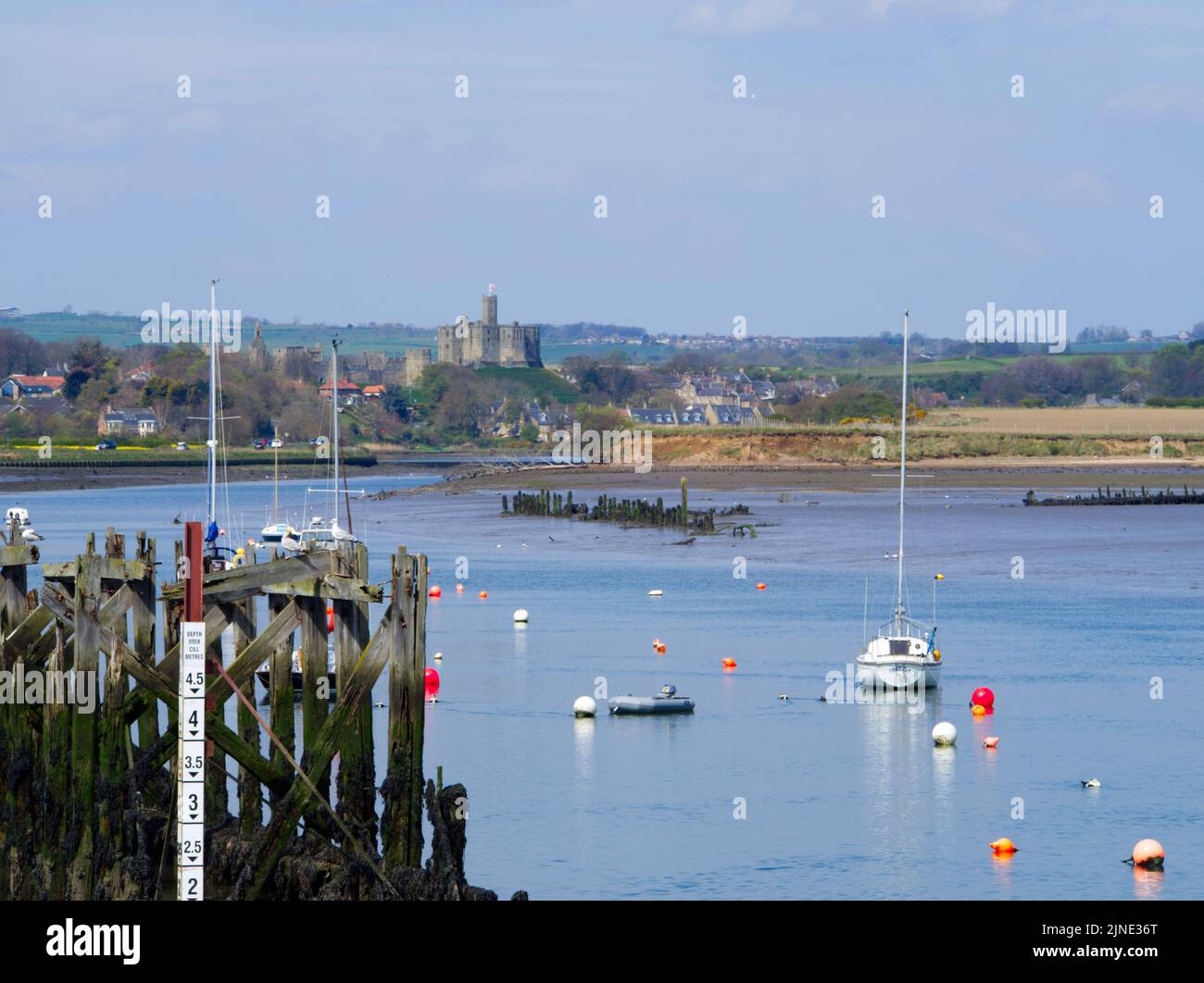 Amble harbour looking towards Warkworth and castle April 2022 Stock ...