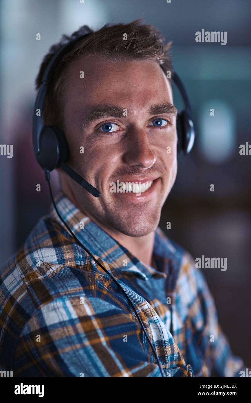 Happy call center agent smiling, ready to help a client on a phone call ...