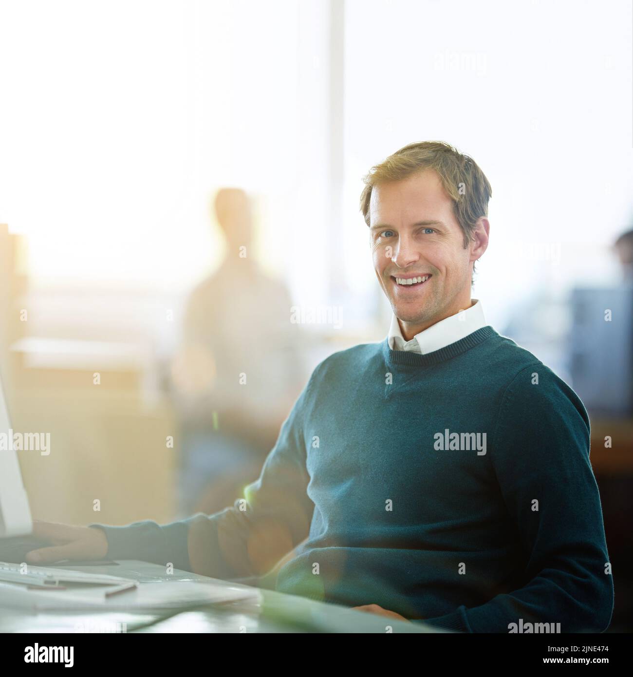 Happy business man with a positive mindset in an office working on an ...