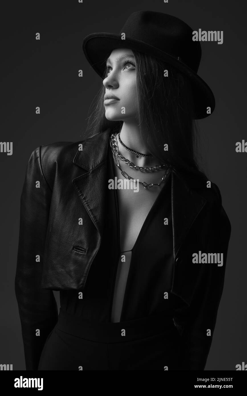 monochrome photo of teenage model in fedora hat posing in studio Stock ...