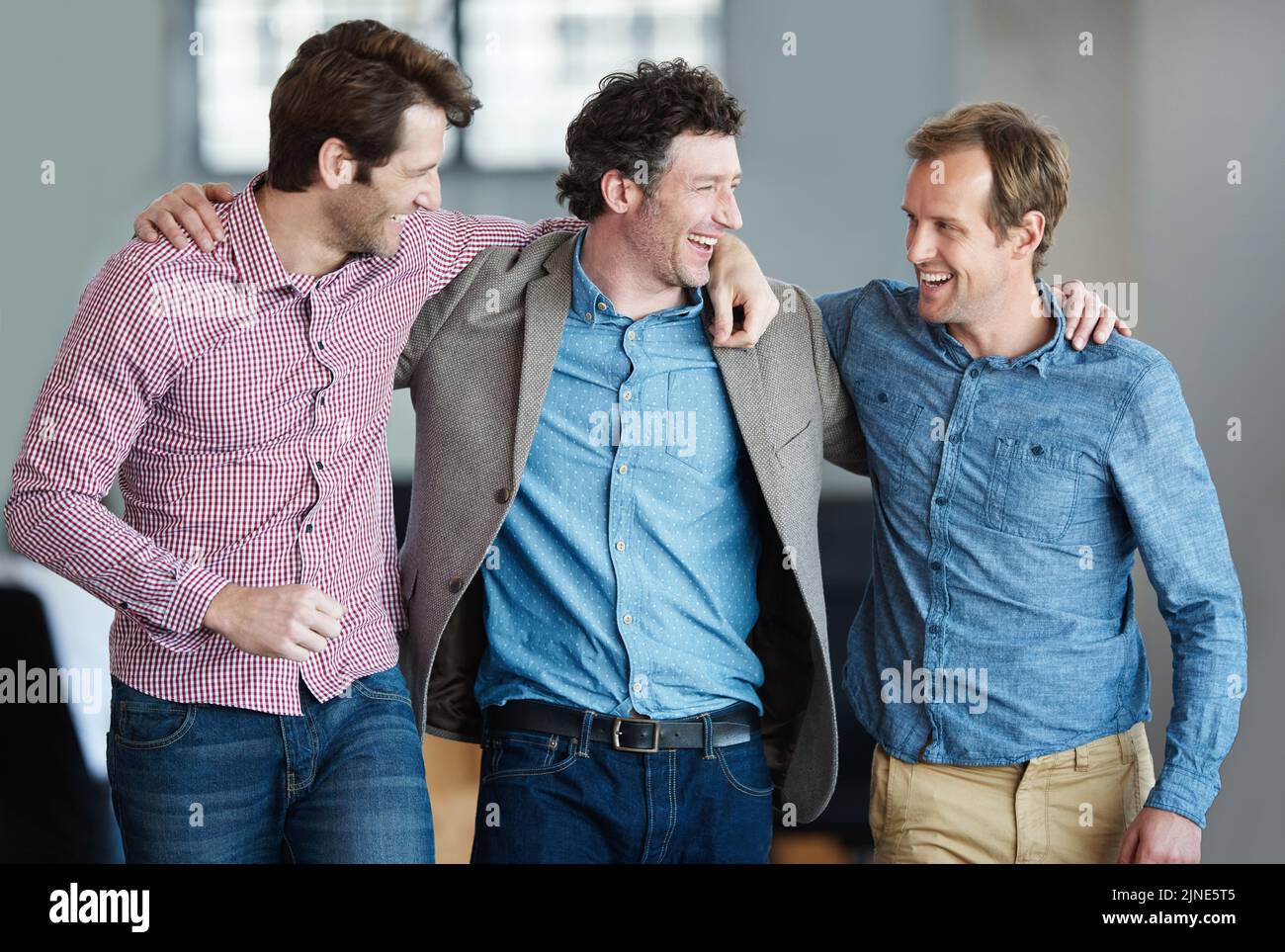 Teamwork, friendship and support with colleagues standing together in a ...