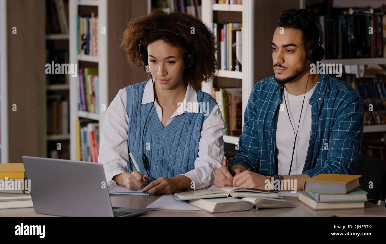 Two teenage students teacher desk hi-res stock photography and images - Alamy