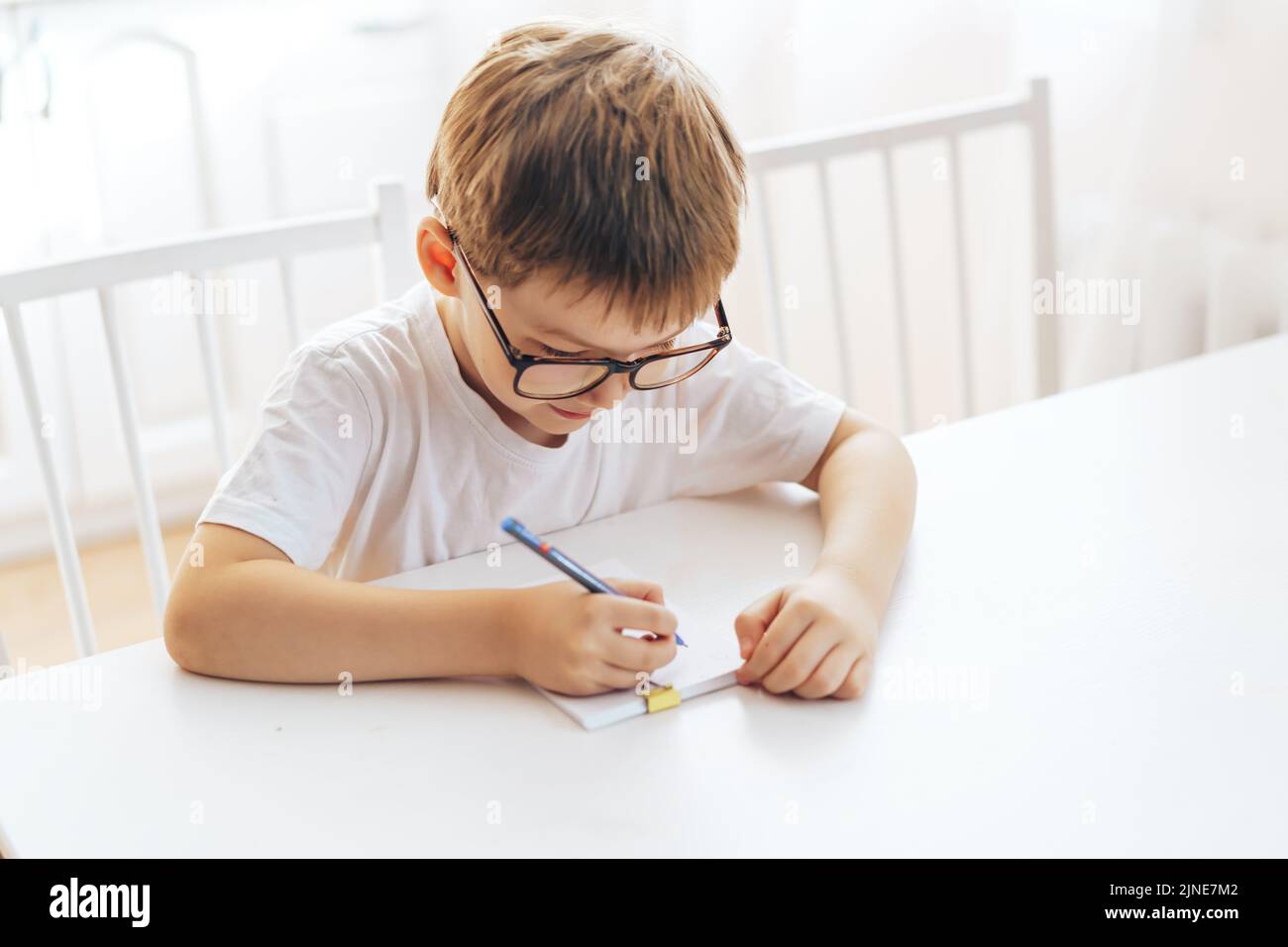 Children school writing eyeglasses hi-res stock photography and images ...