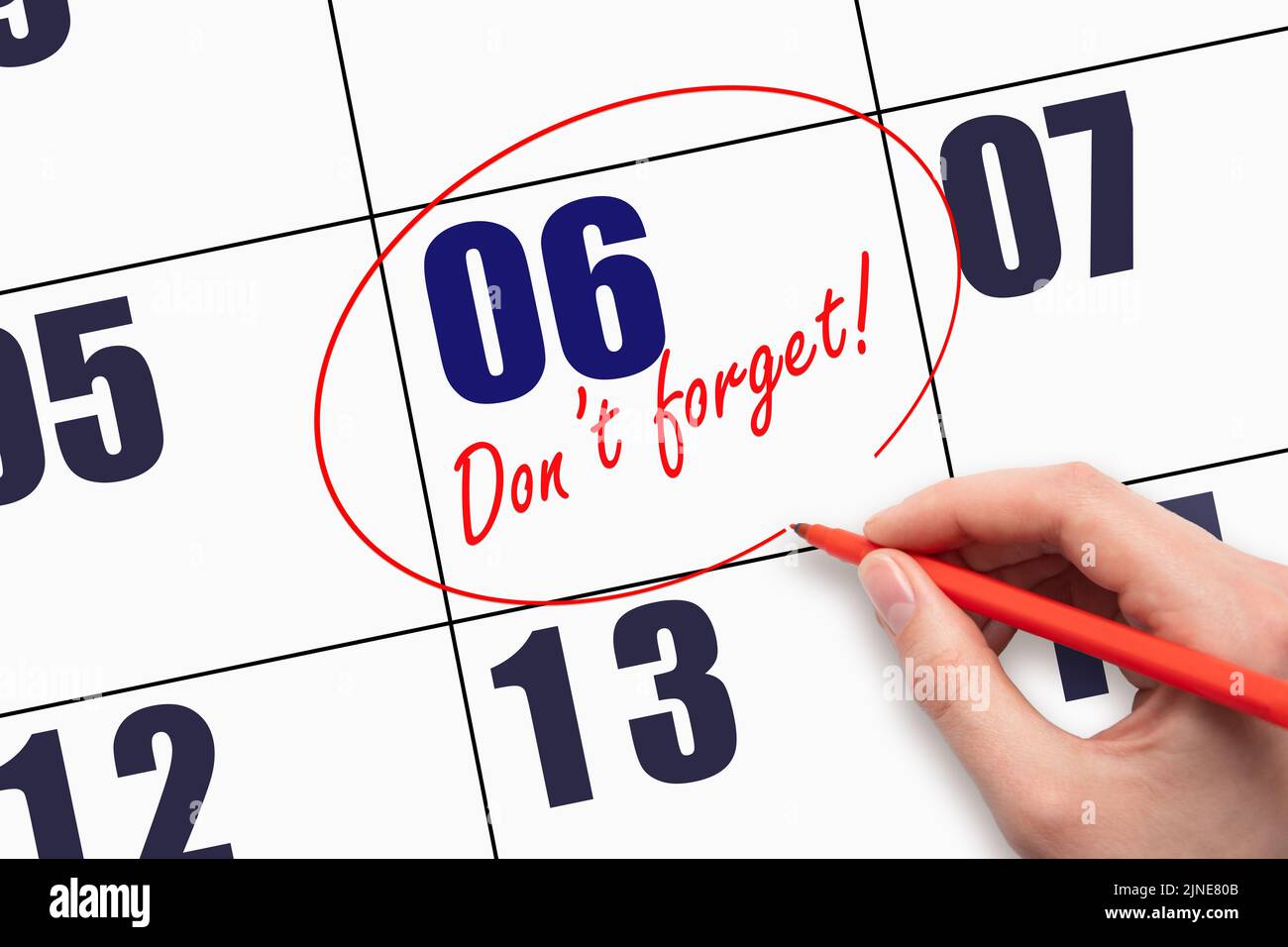 6th day of the month. Hand writing text DO NOT FORGET and circling the ...