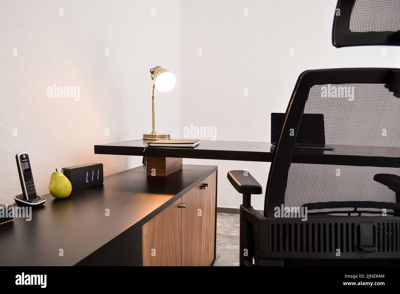 The interior of a modern office space with laptop on a desk Stock Photo ...