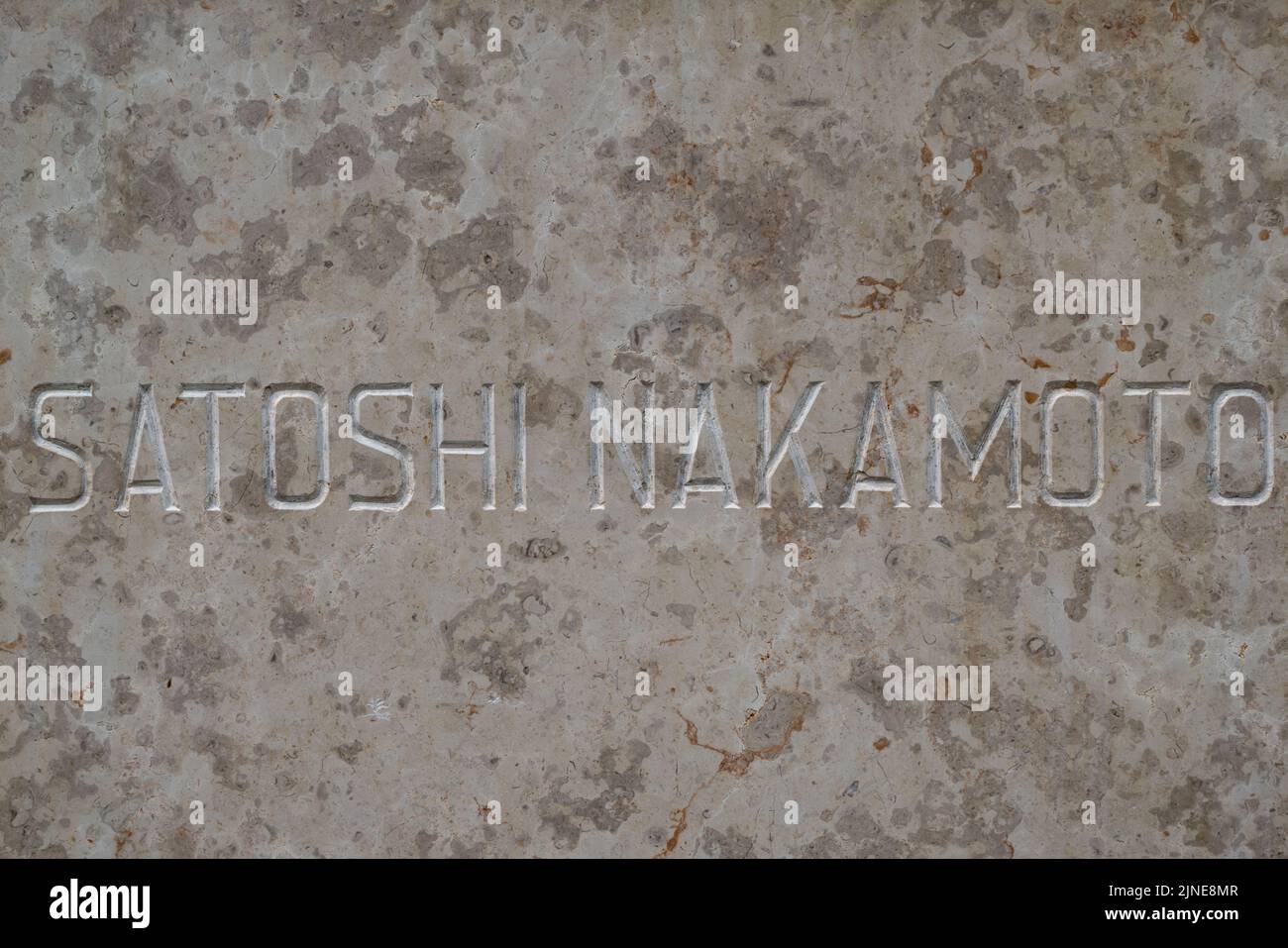 satoshi nakamoto text on a textured marble table Stock Photo - Alamy