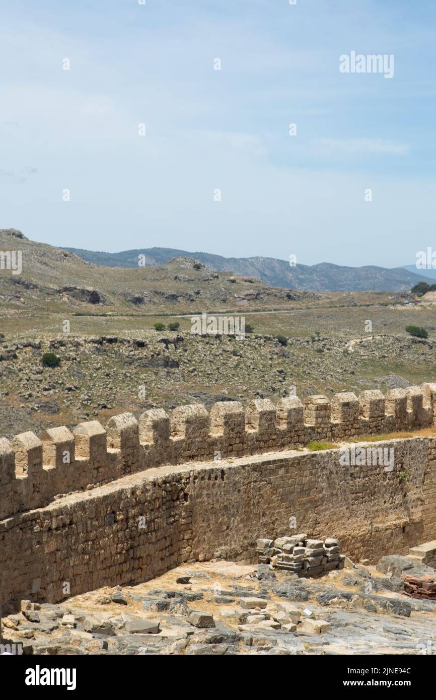 Stone wall of Lindos ancient acropolis and medieavl castle at Rhodes ...