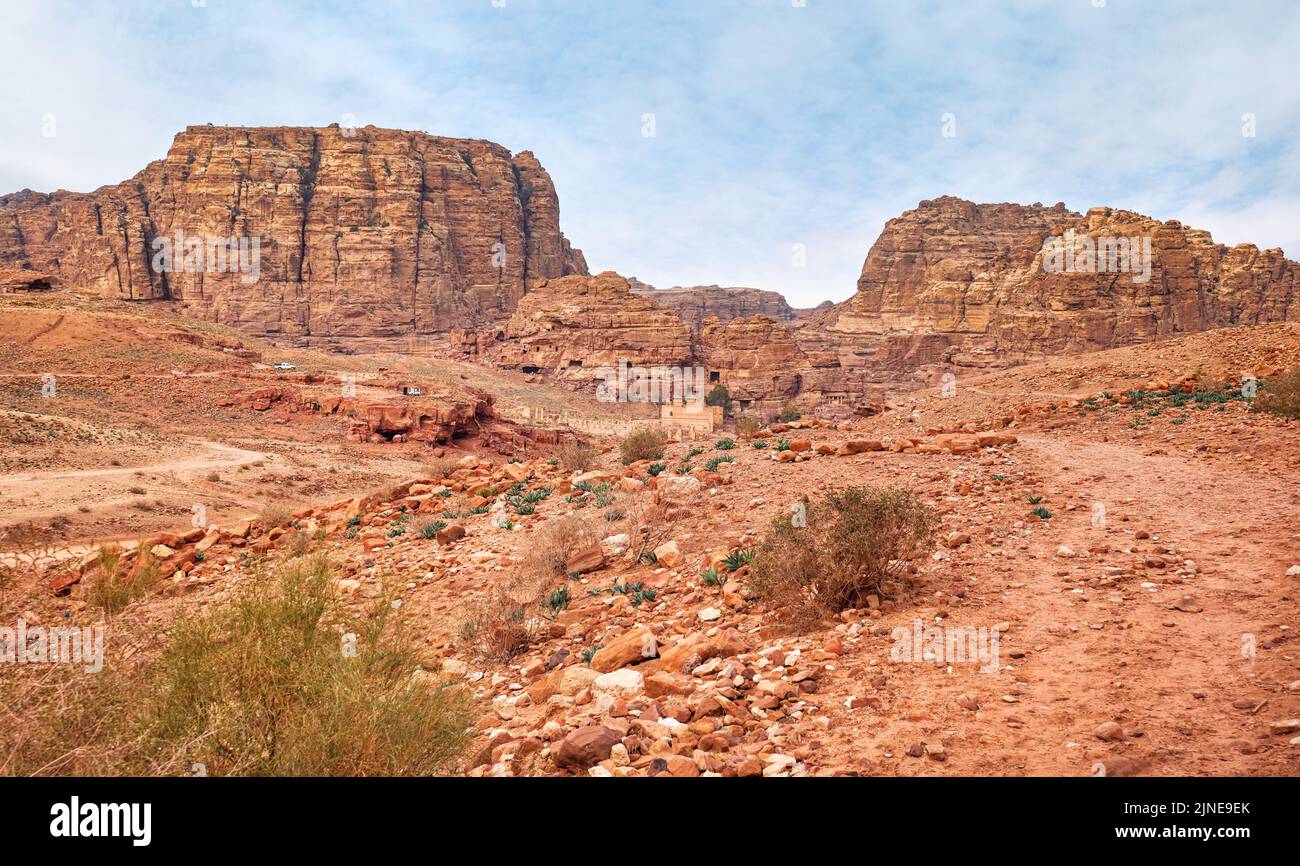 Typical landscape at Petra, Jordan, red dusty ground, mountains with ...