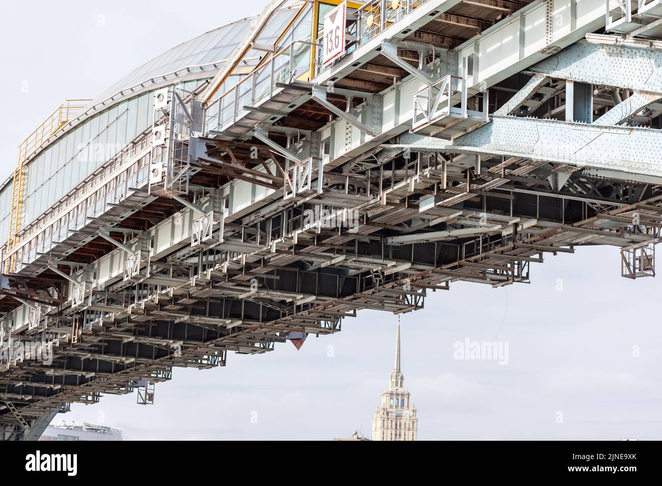 Metal poles pedestrian covered bridge with lots of rivets. Powerful ...
