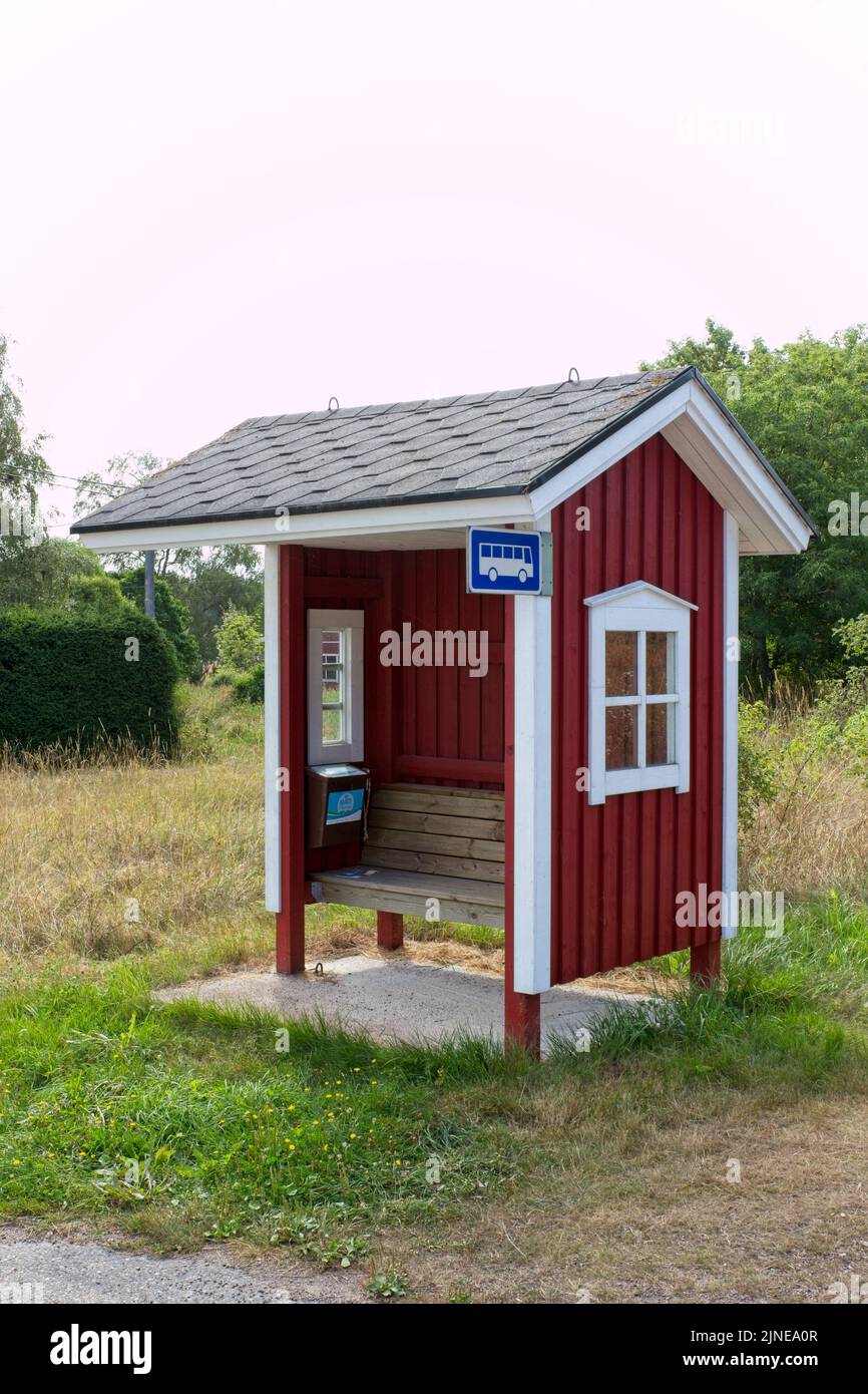 Rural wooden bus stop made of wood and painted red and white Stock ...