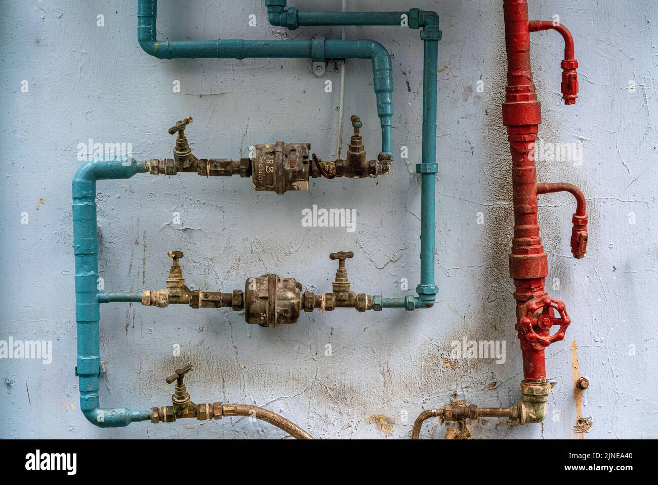 Water pipes with meters reading are hidden in the back alley at Boat ...