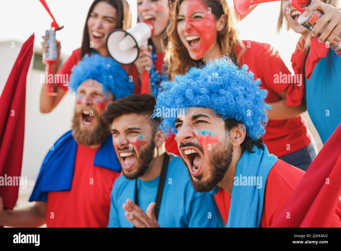 Crazy sport fans screaming while supporting their football team - Soft ...