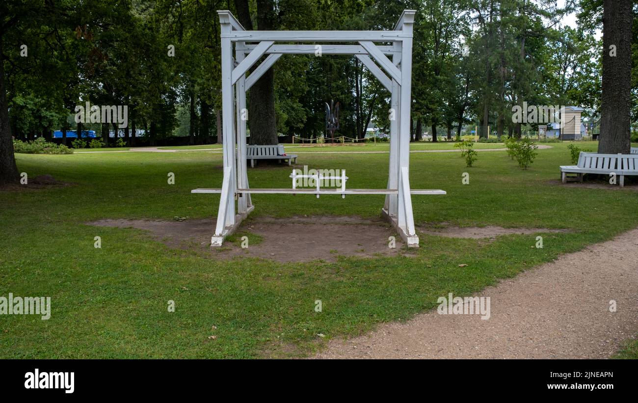 Very large white wooden swing in the park. Summer evening Stock Photo ...