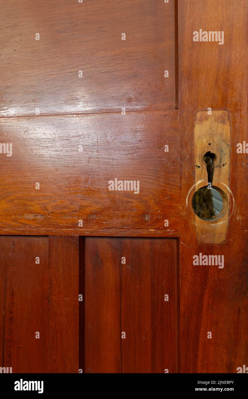 A door is being renovated, it has had its door handle removed during ...