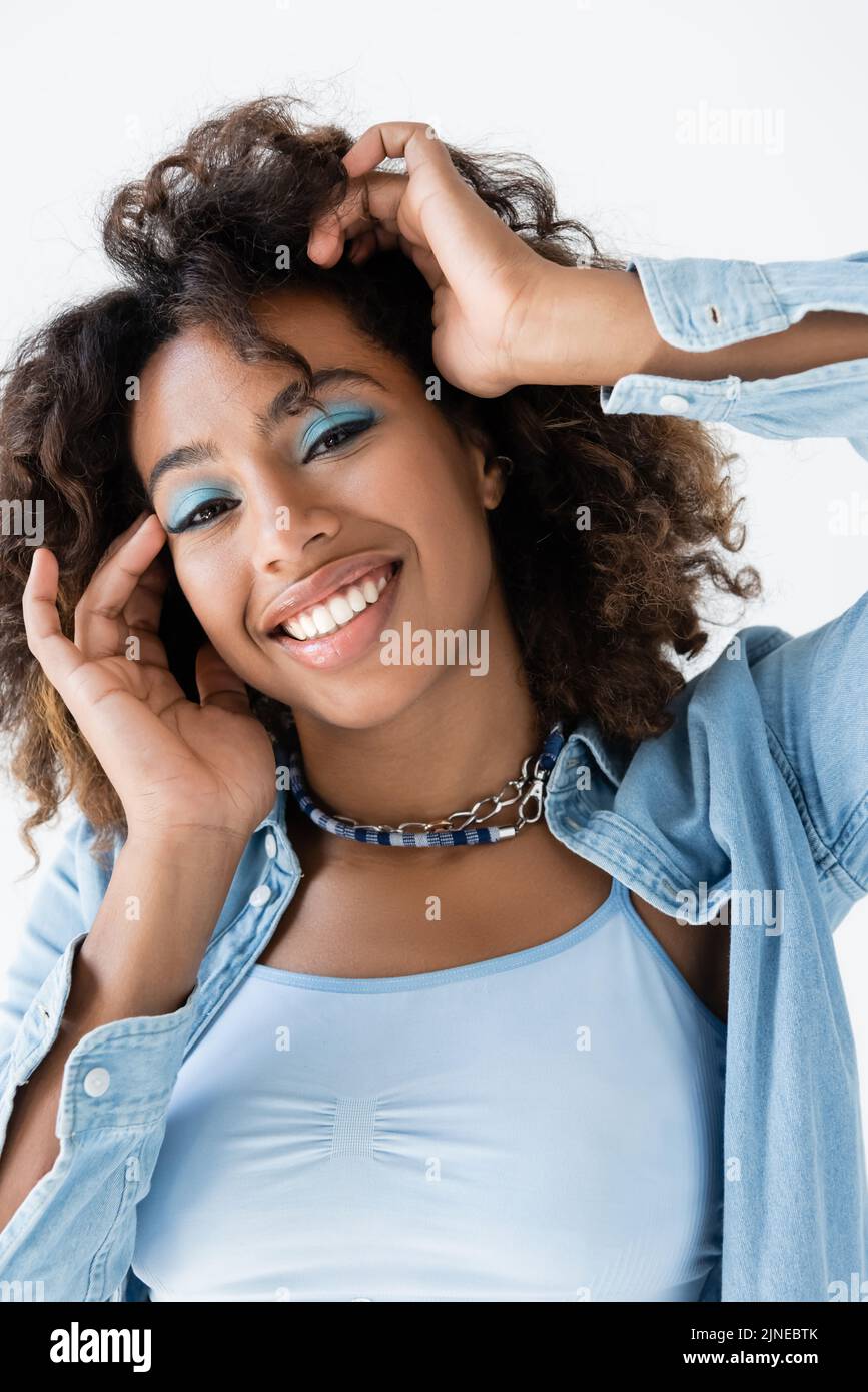 happy african american woman with blue eye shadows and perfect skin ...