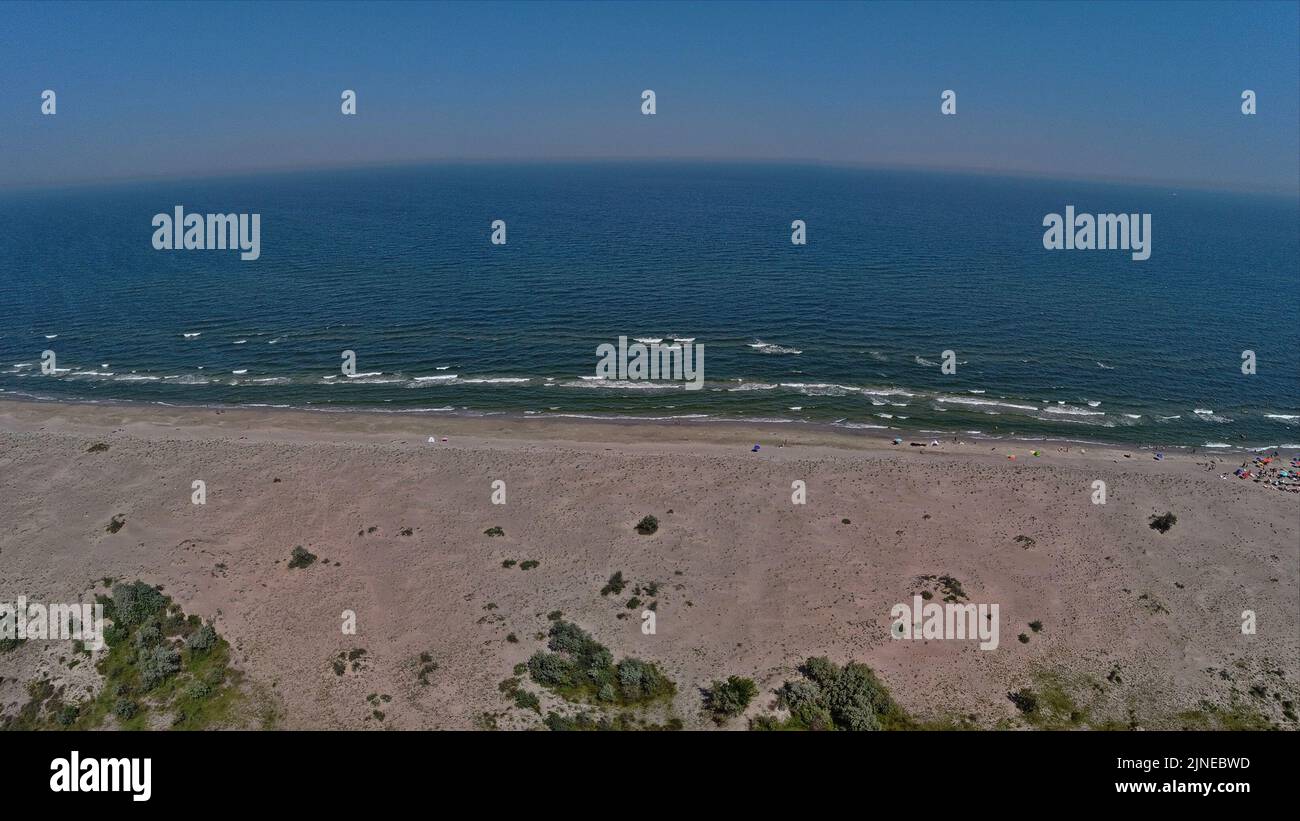 An aerial view of a sandy beach against a blue sea on a sunny day Stock ...