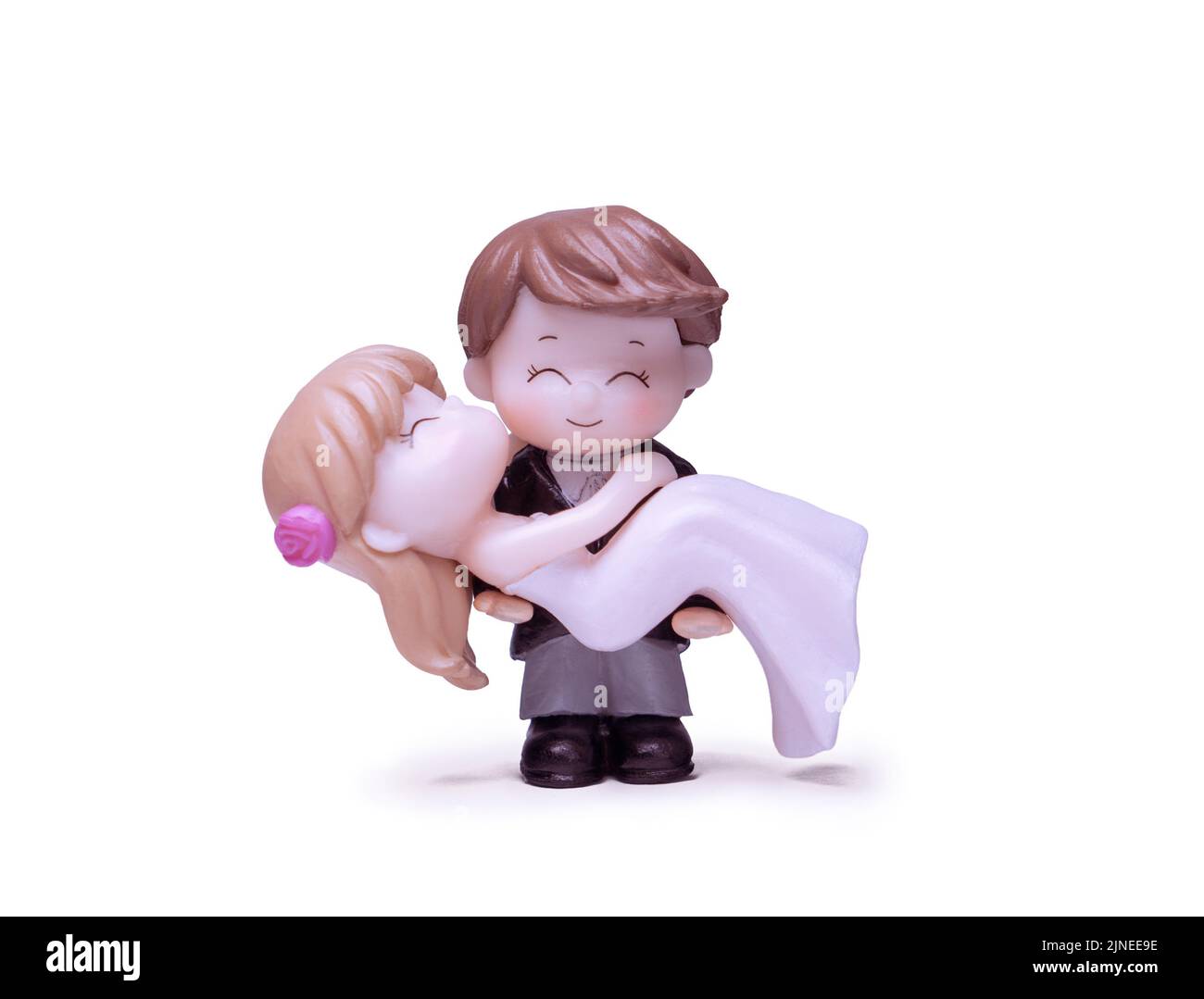 Couple wedding cake topper isolated on white background Stock Photo - Alamy