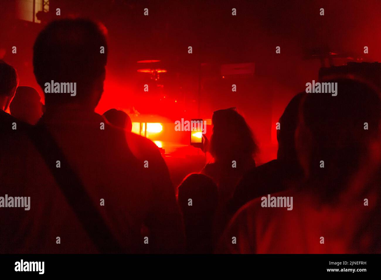 The Audience Watching The Concert On Stage In Big Concert Club Stock the-audience-watching-the-concert-on-stage-in-big-concert-club-stock