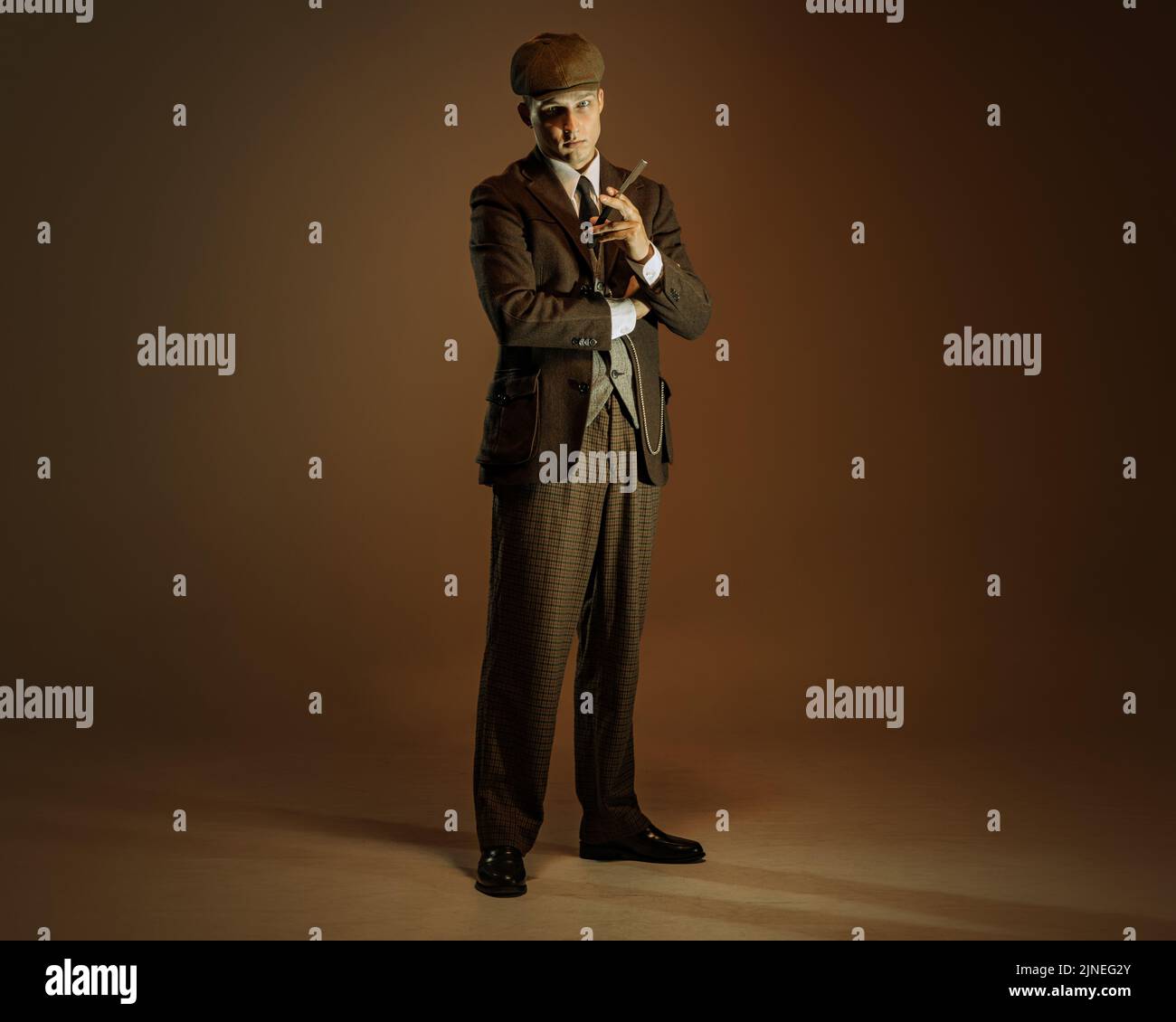 Retro style portrait of young man in image of english gangster ...