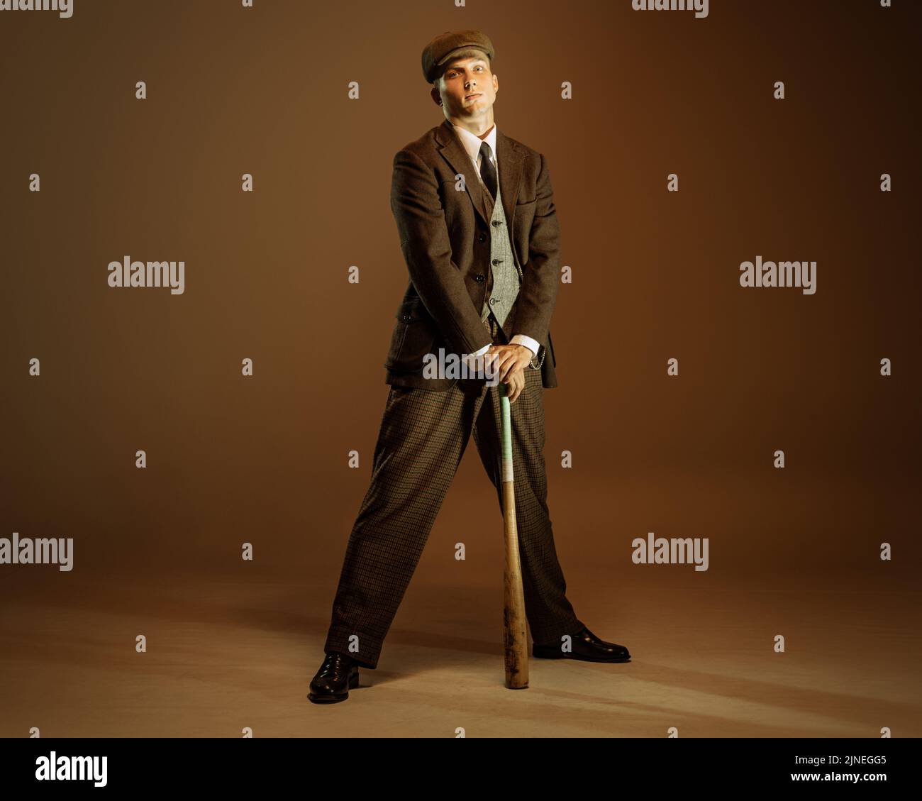 Retro style portrait of young man in image of english gangster ...