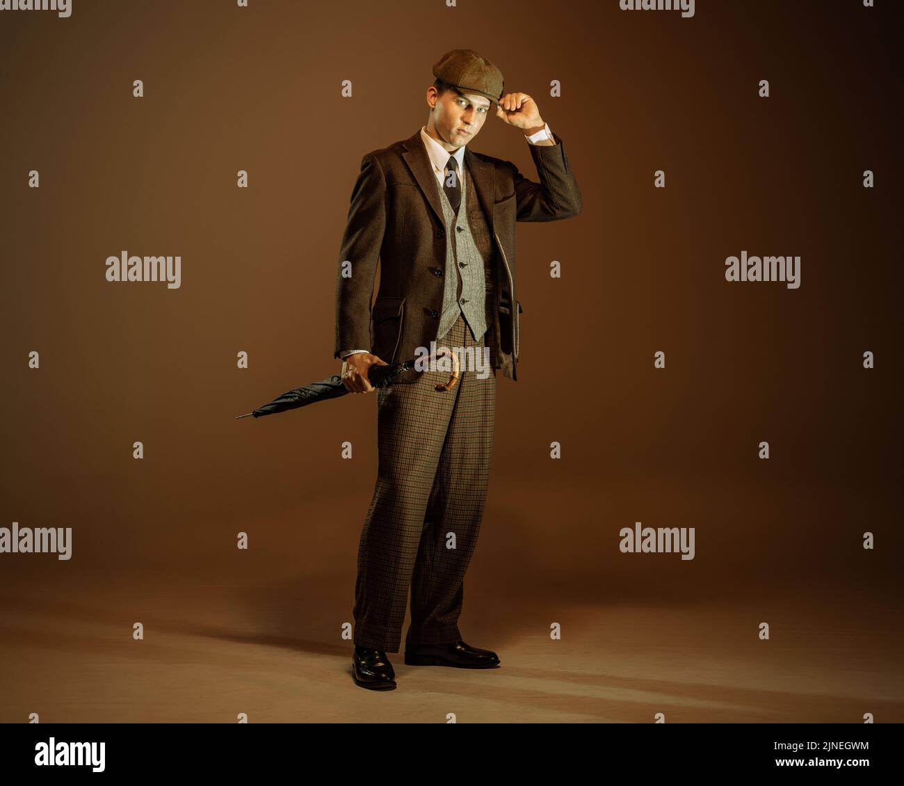 Retro style portrait of young man in image of english gangster ...