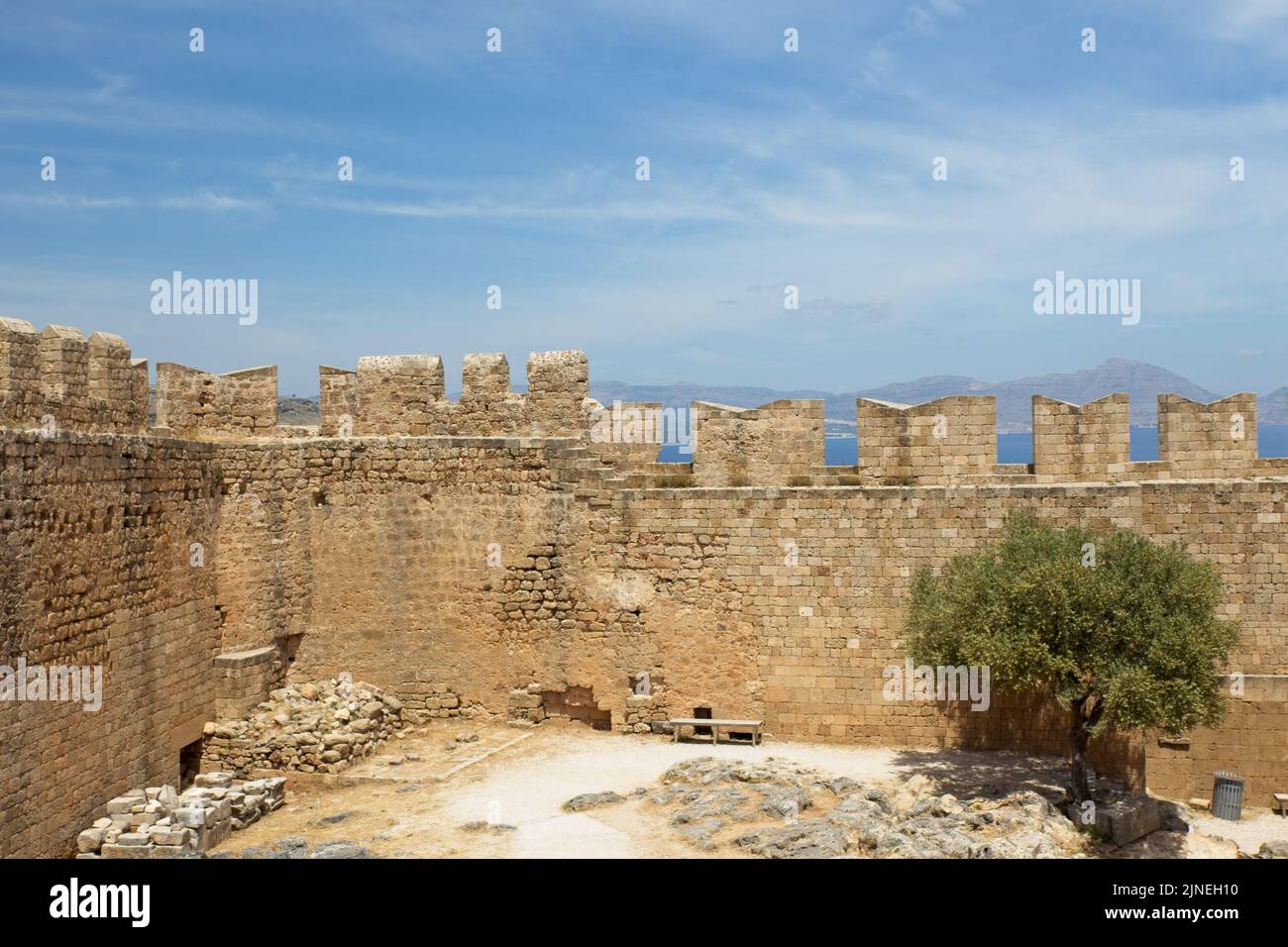 Stone wall of Lindos ancient acropolis and medieval castle at Rhodes ...