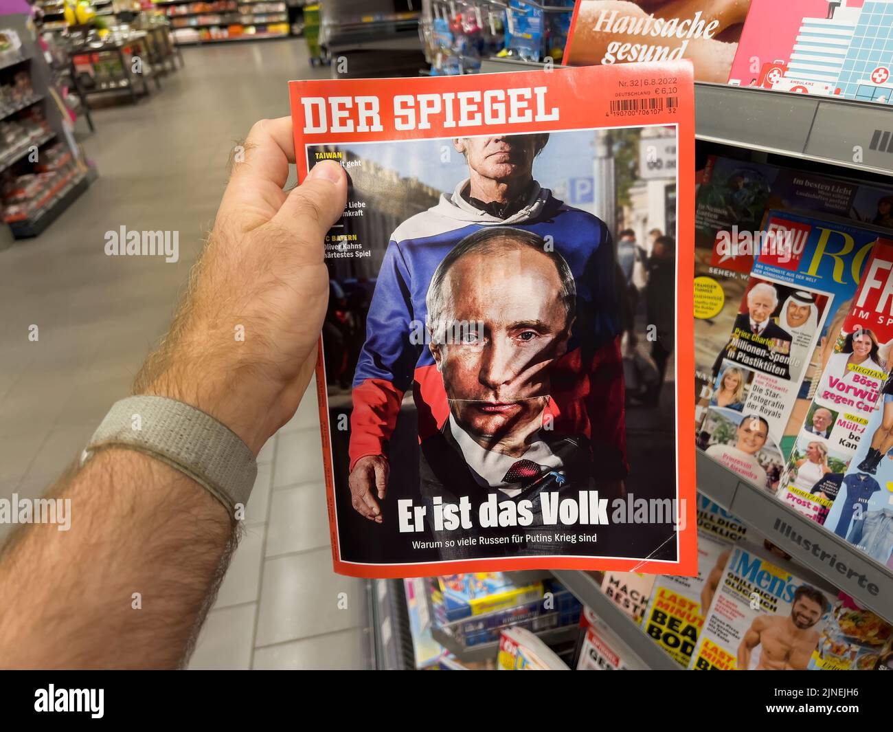 Frankfurt, Germany - Aug 6, 2022: POV male hand holding latest German ...