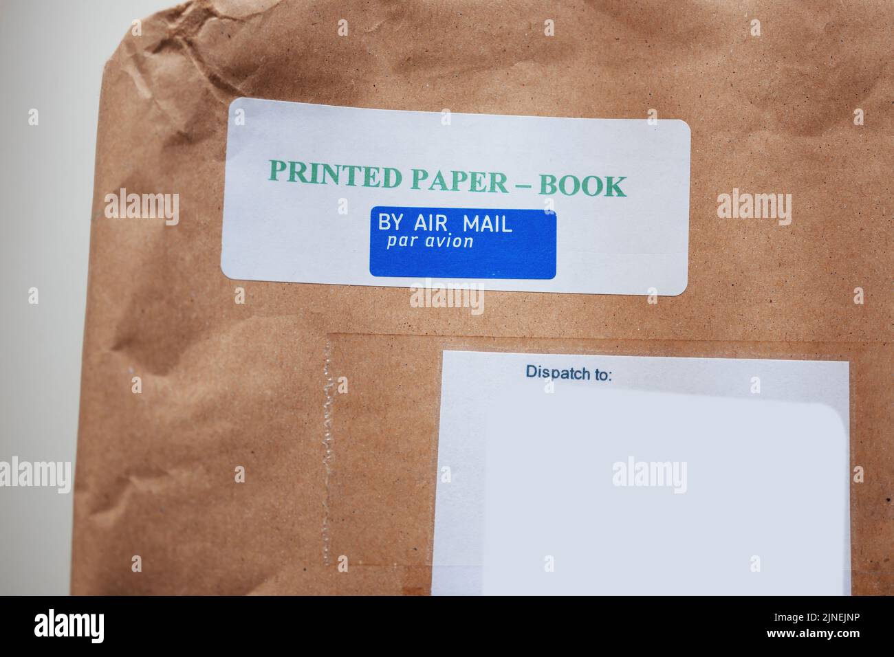 Printed paper book by air mail par avion sticker on the cardboard box ...