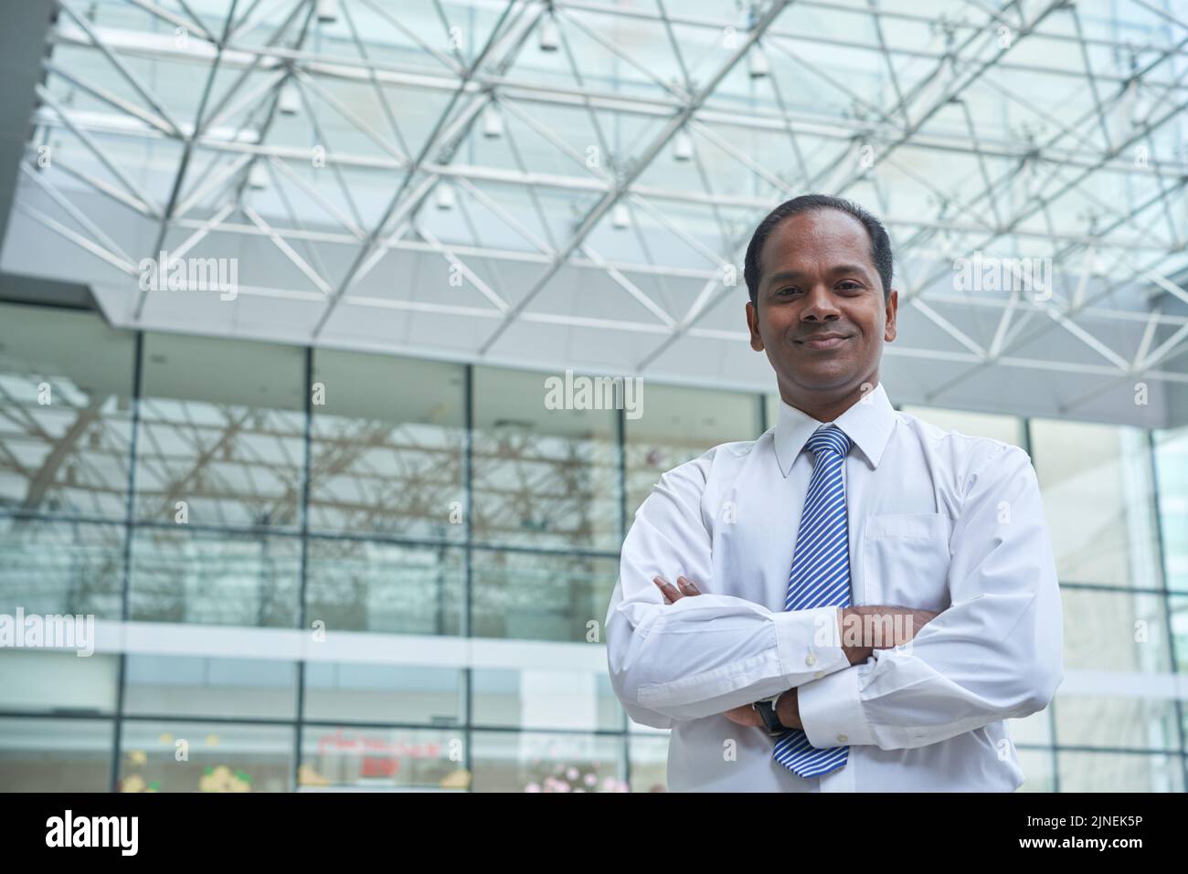 Handsome indian manager looking camera hi-res stock photography and ...