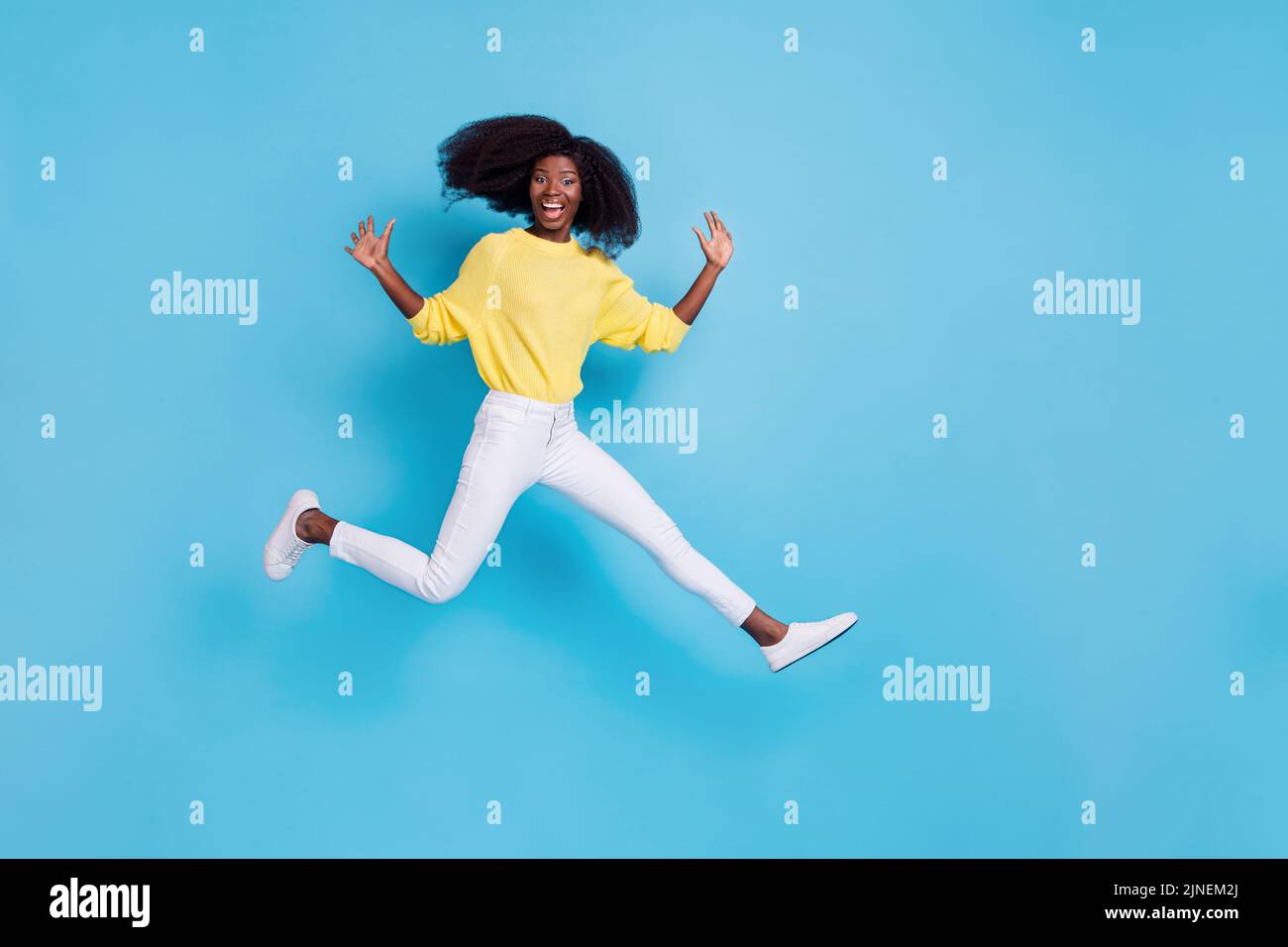 Full length photo of young happy girl hands up jump fly celebrate ...