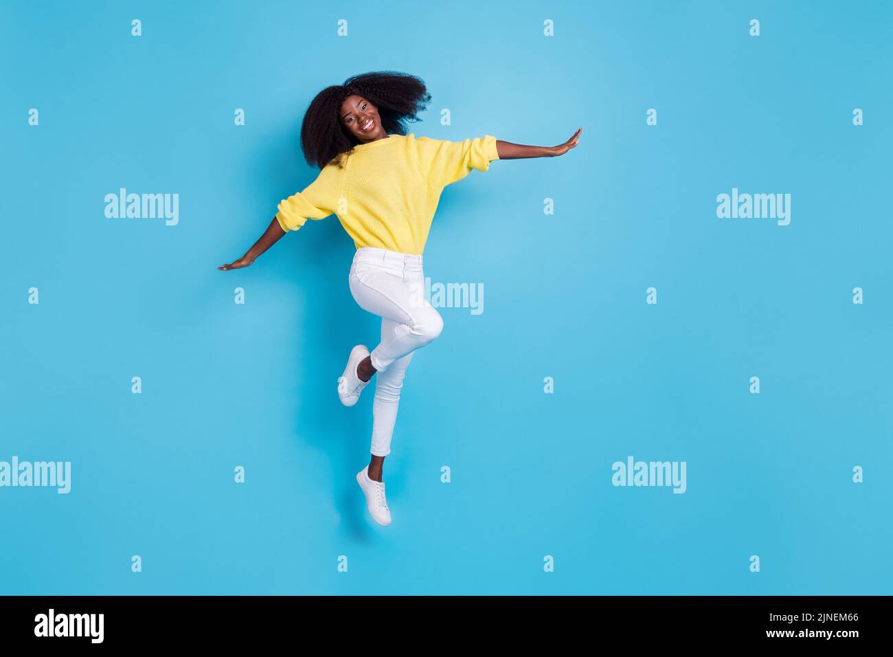 Full length body size photo of young girl simulating airplane flying ...