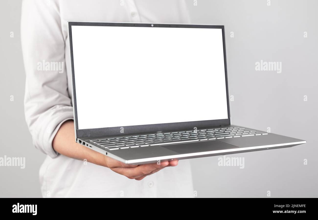 Hands holding laptop mockup. Person showing presentation at business ...