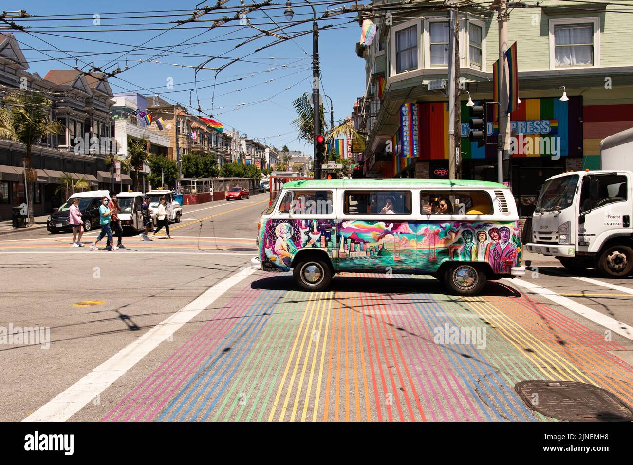 Iconic 70-s era VW hippie van driving in Castro district, famous for ...