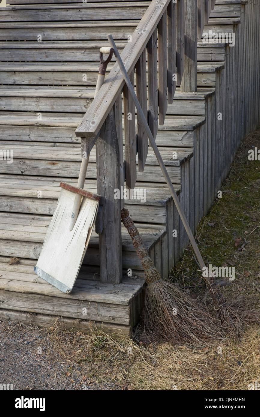Old traditional wooden yard cleaning equipment brush, broom and snow ...