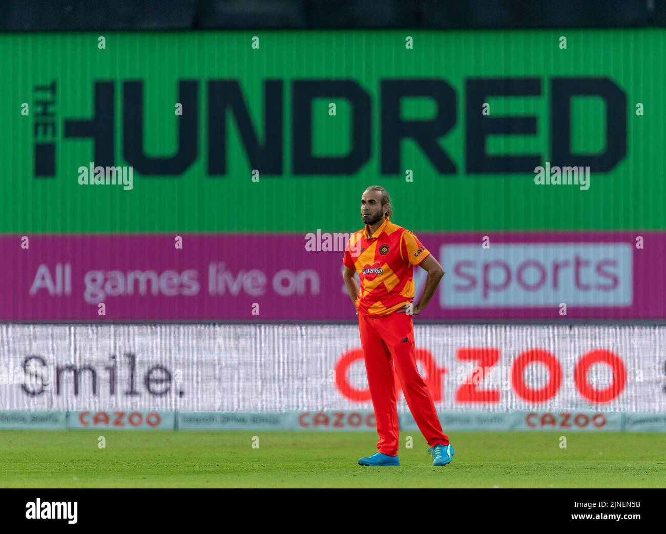 Imran Tahir of Birmingham Phoenix stands in front of The Hundred sign ...