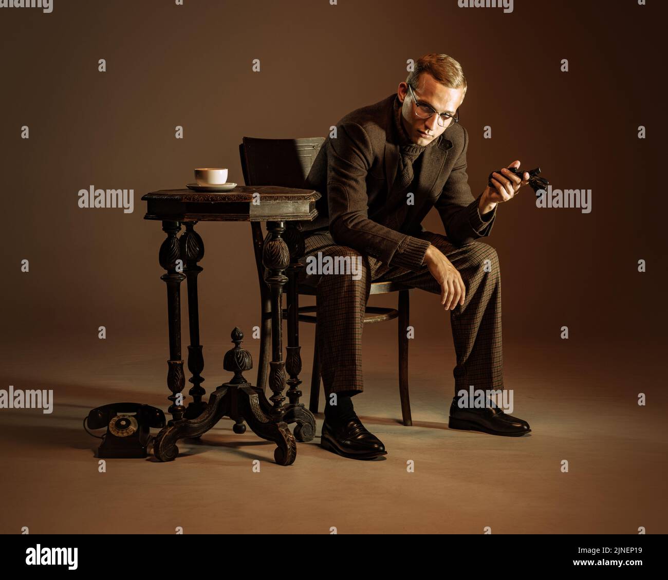 Retro style portrait of young man, writer and traveler wearing vintage ...