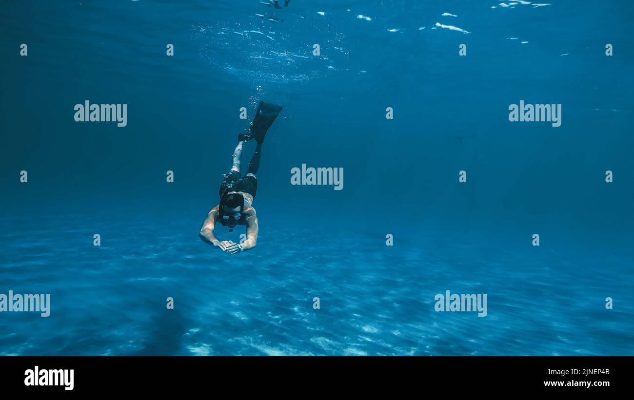 Diving Underwater the sea With Long Fins Stock Photo - Alamy