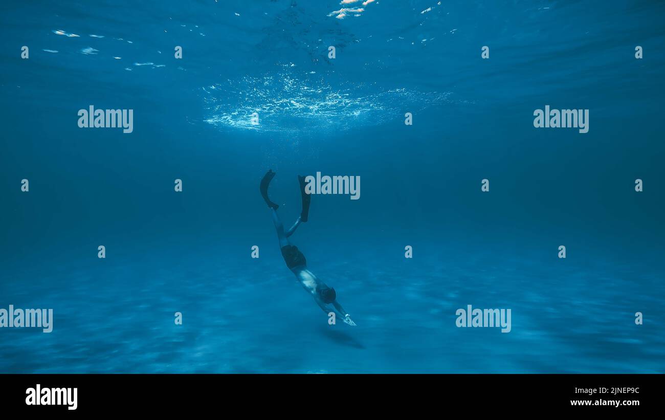 Diving Underwater the sea With Long Fins Stock Photo - Alamy
